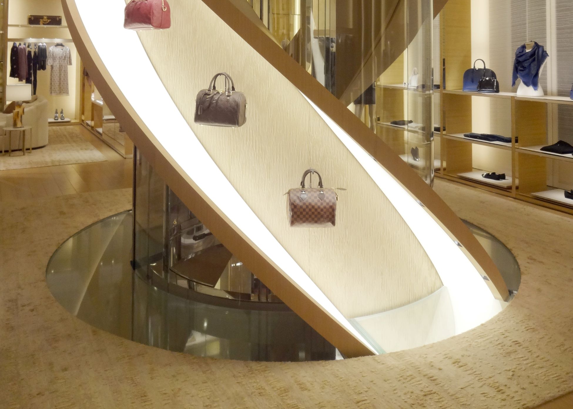 Louis Vuitton halo glass floors - Pads Design Studio